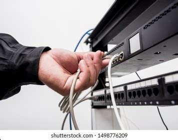 Technician Connecting Network Cables Switches Connecting Stock Photo Shutterstock