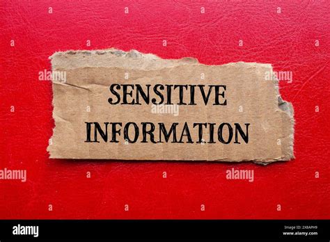Sensitive Information Words Written On Ripped Cardboard Paper Piece