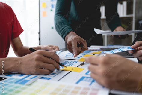 Ux Developers Ui Designers Asian Group Data Researchers Brainstorm On Tabletop Mobile App