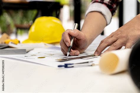Architect Uses A Ruler To Measure The Blueprints Of The Houses He Designed Designing The