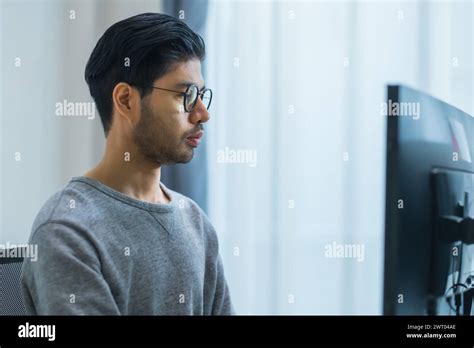 Asian Prompt Engineer Developer Coding App With Software Data Sitting