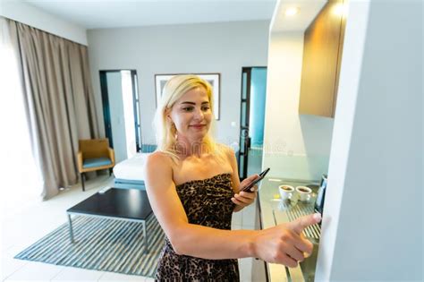 Young Woman Lady Adjusting Remote Climate Control Panel Settings Wall