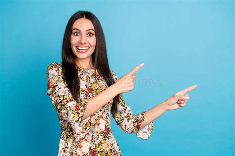 Photo Of Cheerful Pretty Lady Dressed Print Clothes Showing Empty Space Isolated Blue Color