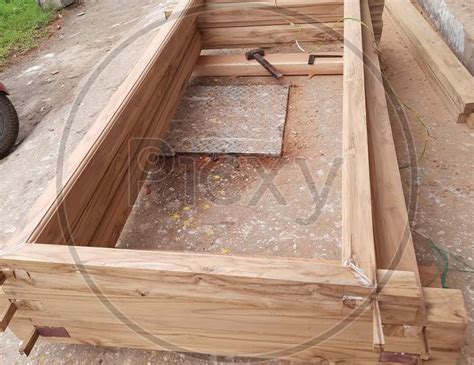 Image Of Closeup Of Wooden Door Vascal Making Outside The Shop By