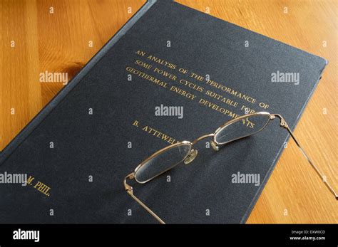 A Master S Degree Bound Thesis Subject Geothermal Energy Lying On A Wooden Surface With A Pair