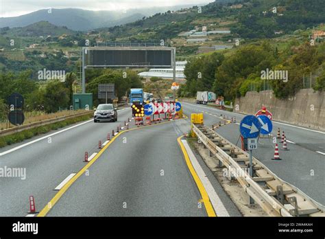 Exit From The Road Section Being Repaired Road Signs Indicating The Direction Of Travel