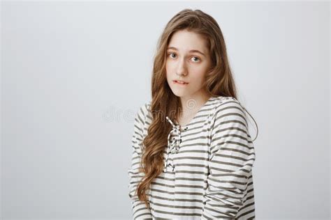 Girl Glancing With Angel Expression Trying To Persuade Boyfriend She