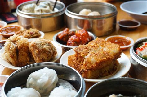 Traditional Chinese Dim Sum In Metal Bowl On Wooden Table A Lot Of Different Kinds Of Food And