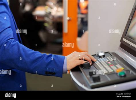 Engineer Working With Cnc Control Console Of Metalworking Lathe Machine