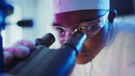 Scientist Looking Through Microscope In Laboratory Stock Video Video Of Concentration