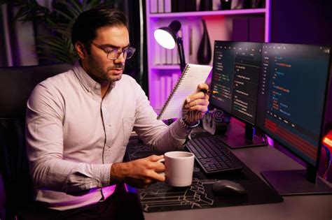 it working with drinking coffee coding on pc screen reading note