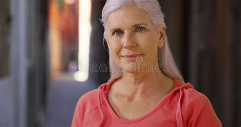 Casual Portrait Of Cute Happy Mature Woman Smiling At Camera Stock