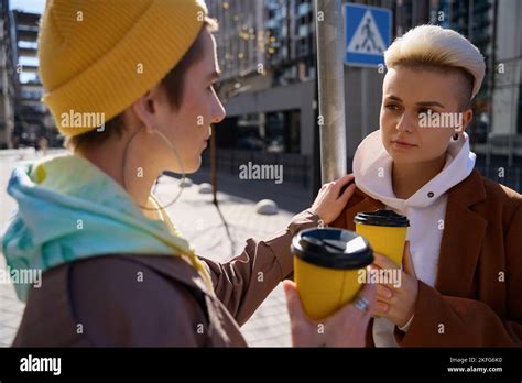 Woman Put Her Hand On Shoulder Of Her Friend Stock Photo Alamy