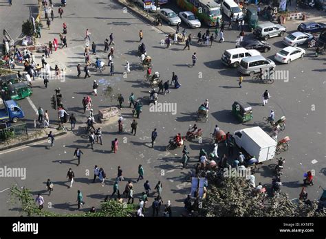 Street Car Traffic And Crowd Of People Walking Across Busy Road In