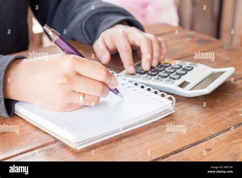 Woman Hand With Pen Writing On Notebook Stock Photo Alamy
