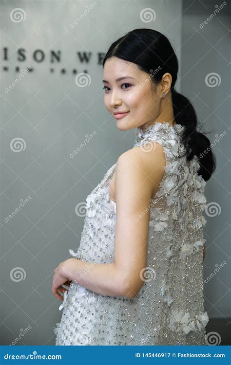 A Model Poses During The Allison Webb Spring 2020 Bridal Fashion Presentation Editorial
