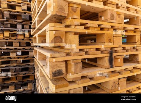 Piles Of Stacked Natural Wooden Shipping Pallets Outside A Big Stack