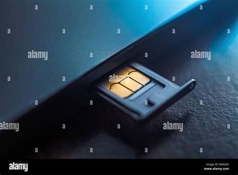 Sim Card In Tray Being Inserted Into Phone Stock Photo Alamy
