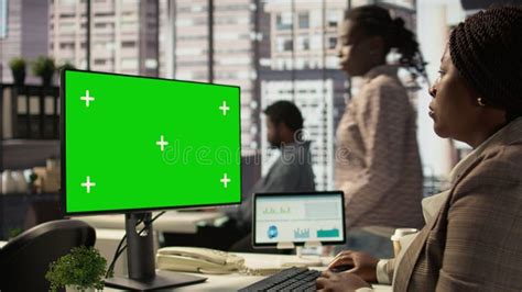 woman at her desk working on data analysis next to mockup display stock footage video of