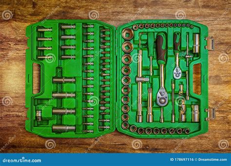 Open Toolbox With Different Instruments On Wooden Workbench Stock