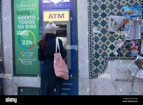 Girl Withdrawing Money At An ATM Stock Photo Alamy