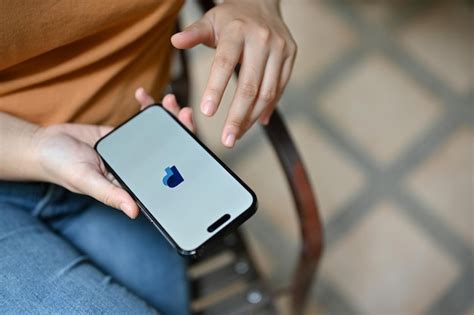 Premium Photo A Female Using Paypal Application On Her Iphone While Premium Photo A Female Using Paypal Application On Her Iphone While