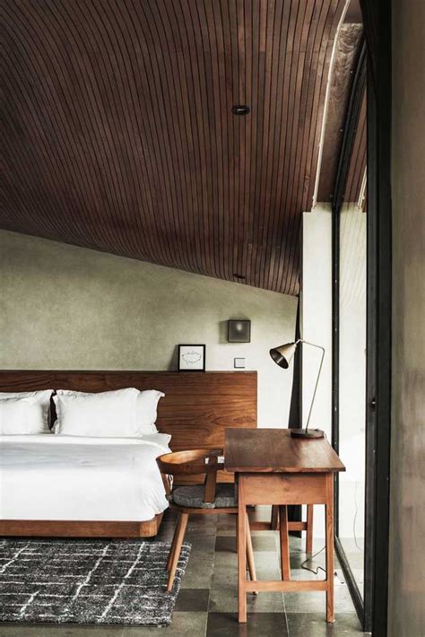 Curved Architectural Elegance With Wood Patterned Interiors Amidst