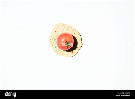 Flat Lay Of Ripe Juicy Tomato On A Freshly Baked Homemade Chapati Pita Bread Flatbread