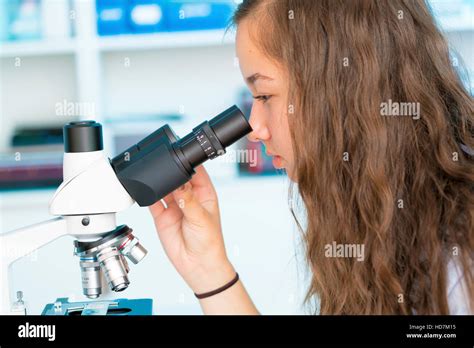 MODEL RELEASED Girl Using Microscope Close Up Stock Photo Alamy