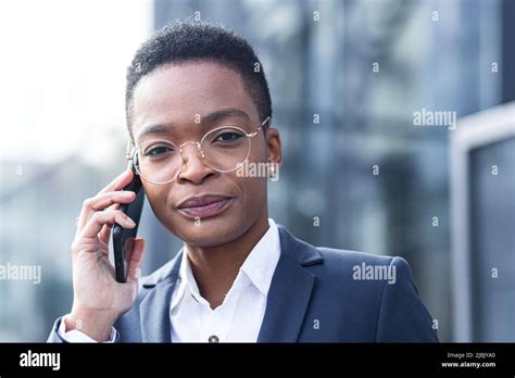 Close Up Photo Portrait Of A Young Business Woman African American Woman Talking On The Phone