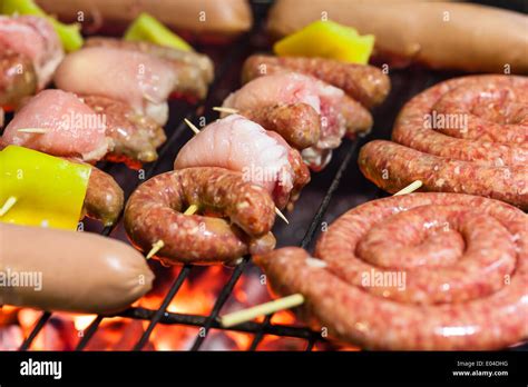 Different Types Of Meat Cooking Outside On A Barbecue Stock Photo Alamy
