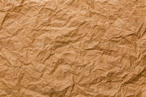 Ragged Crumpled Brown Kraft Paper Texture And Full Frame Background