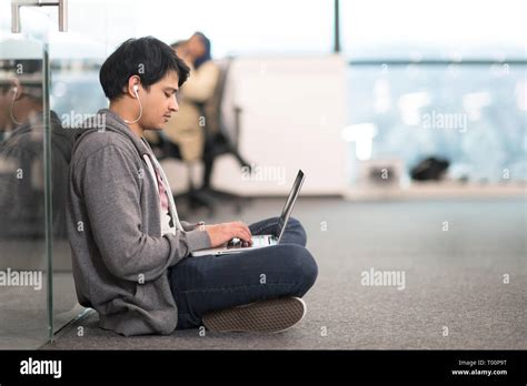 Young Indian Software Developer Man Using Laptop Computer Writing