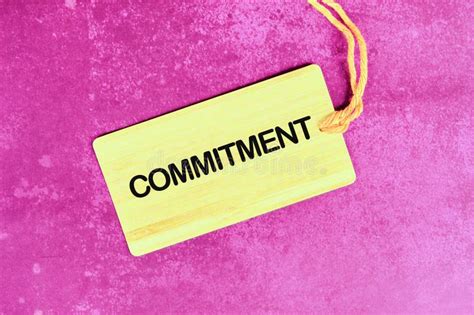 Commitment Word Written On The Card On An Abstract Bright Background