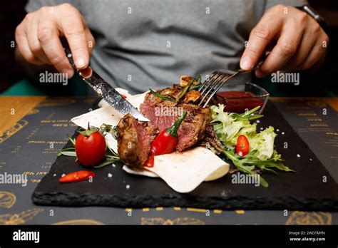 Steak On The Board Restaurant Meat Hand High Quality Photo Stock
