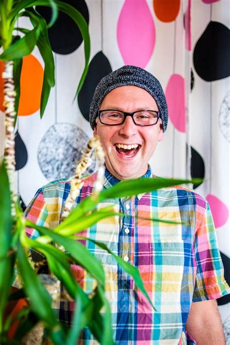 Laughing Nerd Looking From Behind Green Plant Stock Image Image Of