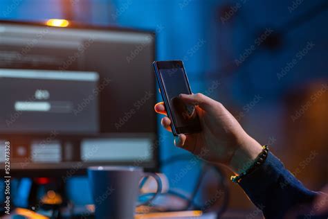 Cybercrime Hacking And Technology Concept Close Up Of Male Hacker With Smartphone Using