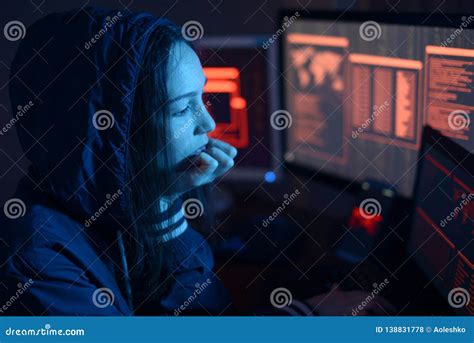hooded hacker girl is thinking about the problem of hacking or malware