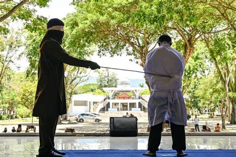 Two Men Publicly Flogged In Indonesia For Gay Sex