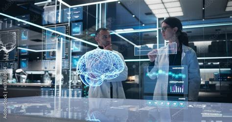 Two Neuroscientists Working With Computer-Powered Animated VFX Hologram Of Human Brain And ...