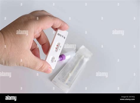 Closeup Female Hand Holding Test Cassette Medical Disposable Sterile Test Kit For Rapid Test