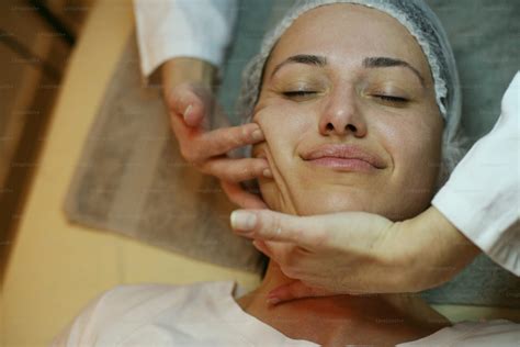 Woman Having Her Face Massaged Photo The Human Body Image On Unsplash