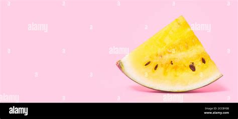 Banner Slices Of Yellow Watermelon On A Pastel Pink Background Copy