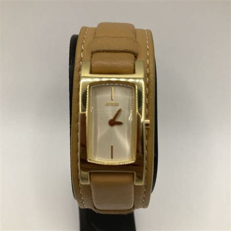Womenâ S Guess Watch Gold Tone Rectangle Case Tan Leather Cuff Strap