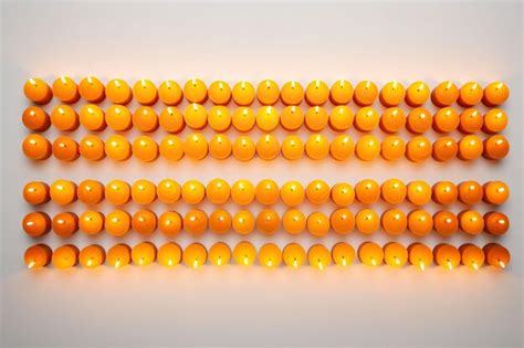 Premium Ai Image A Group Of Oranges Are Arranged In A Row