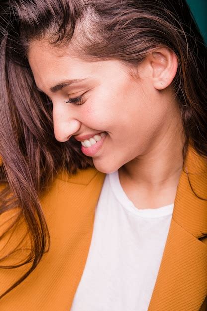 Free Photo Smiling Brunette Girl Posing With Coat