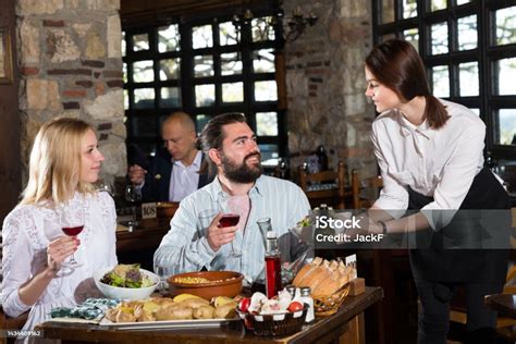 Beautiful Couple Eating Out At A Restaurant While Young And Obliging