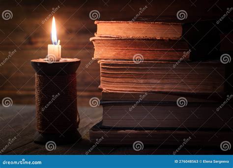 Old Books On A Wooden Table By Candlelight Stock Image Image Of Book Novel