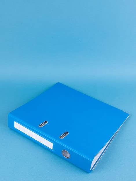 Premium Photo Blue Binder File Folder On Blue Background Close Up