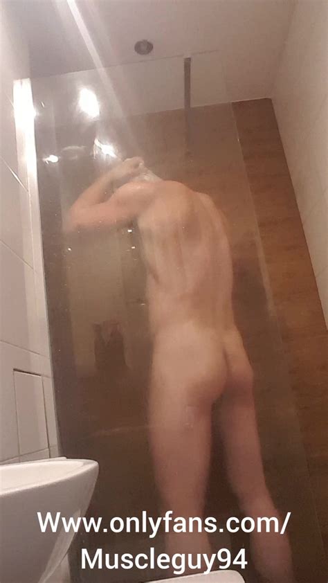 Muscular Guy Cleaning Body Shower